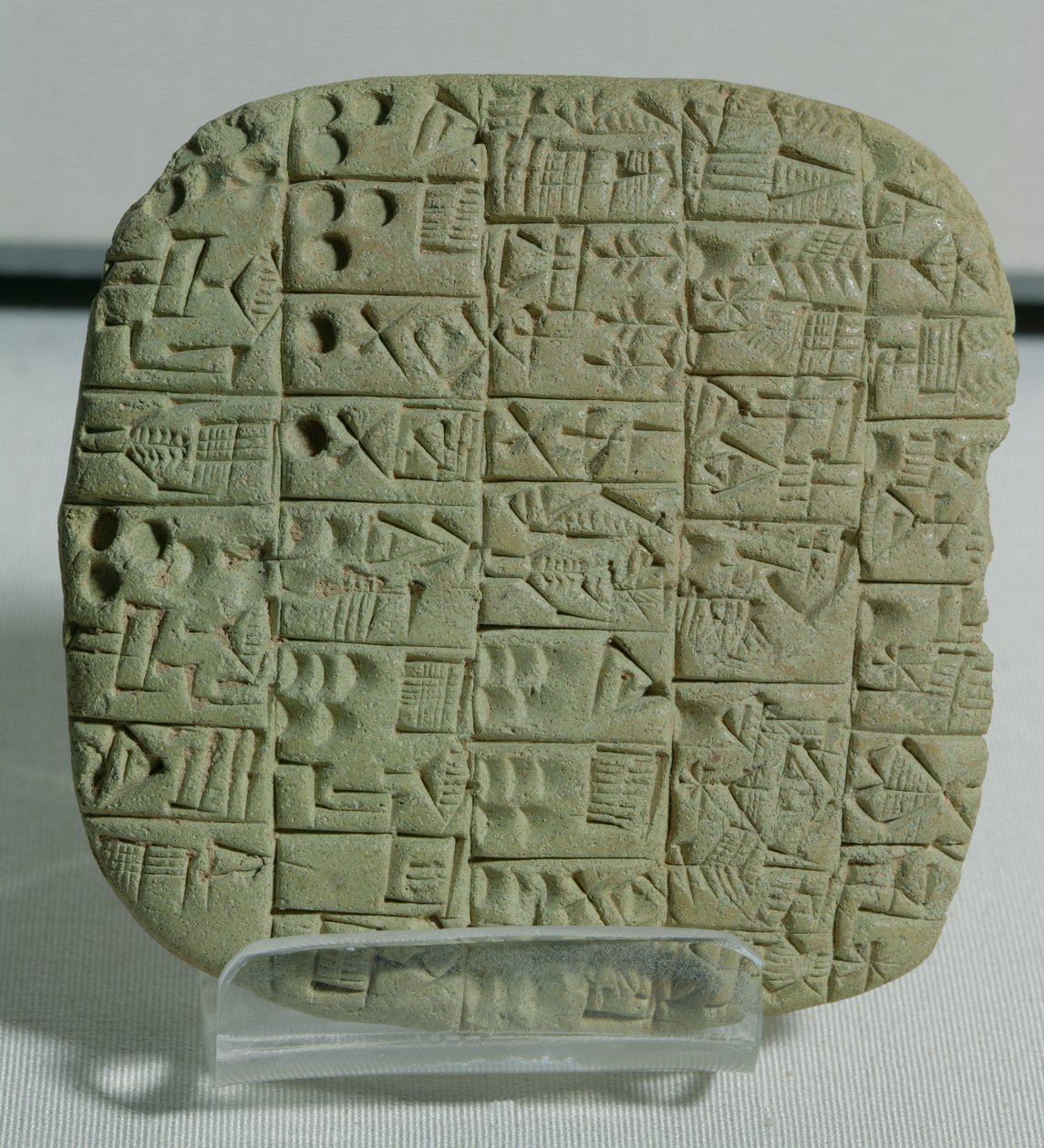 Tablet with cuneiform script detailing a contract for selling a field ...
