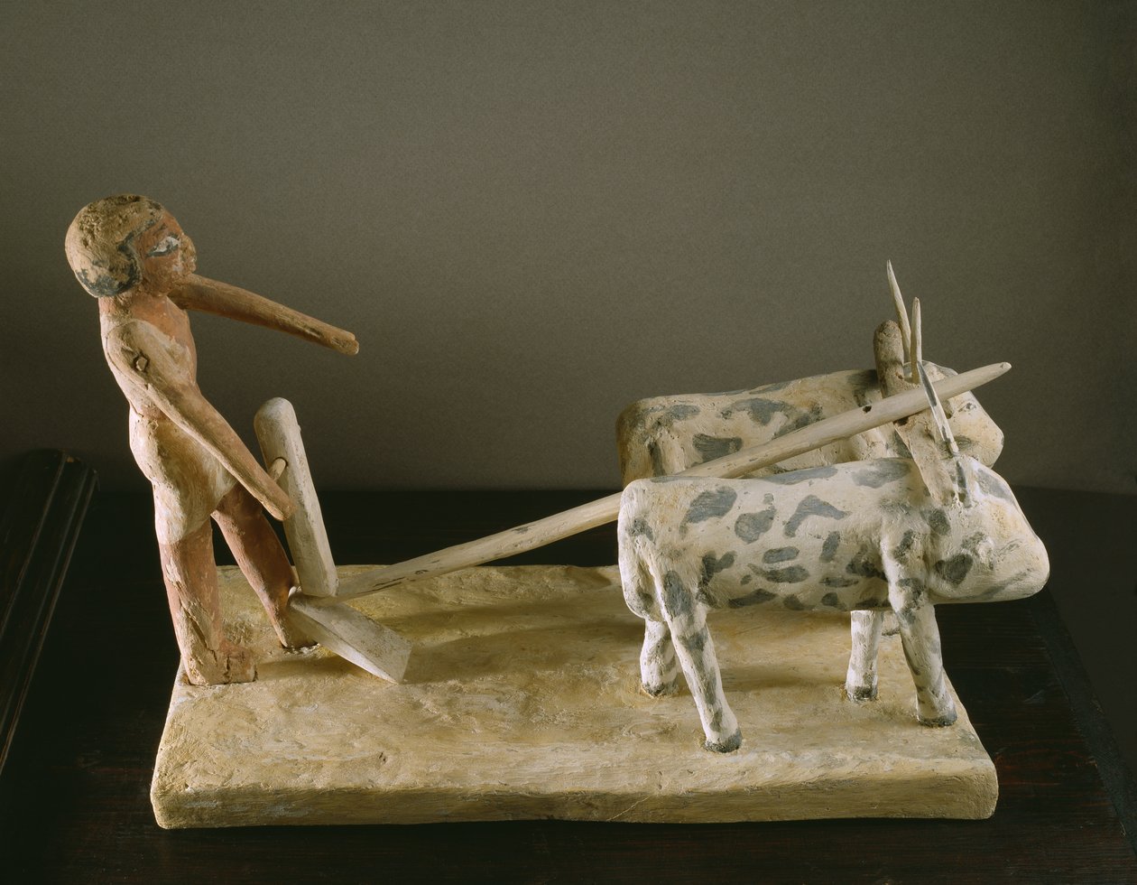Funerary model of a ploughman leading his plough drawn by two oxen