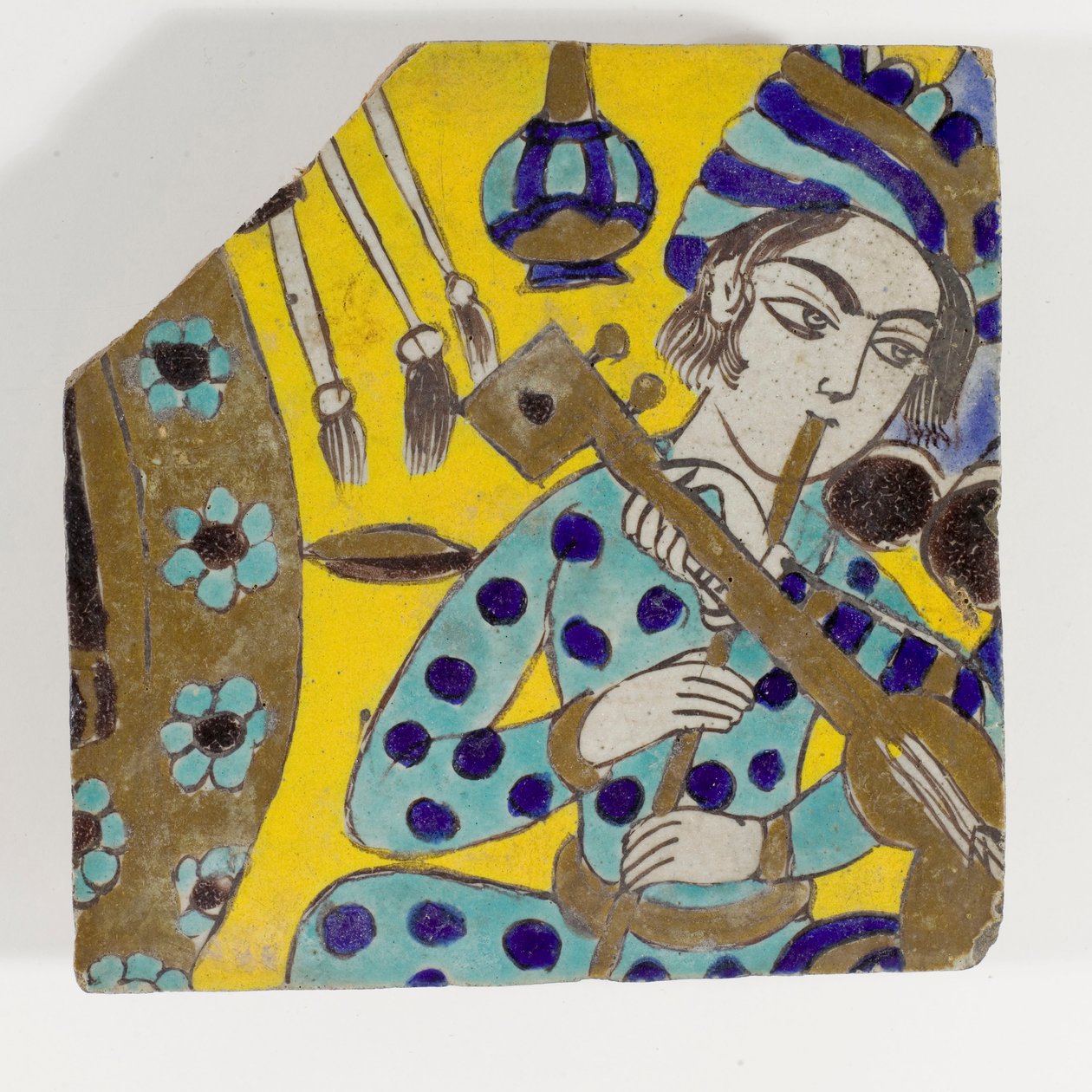 Safavid Persia Pottery Tile Depicting a Man Playing a Flute