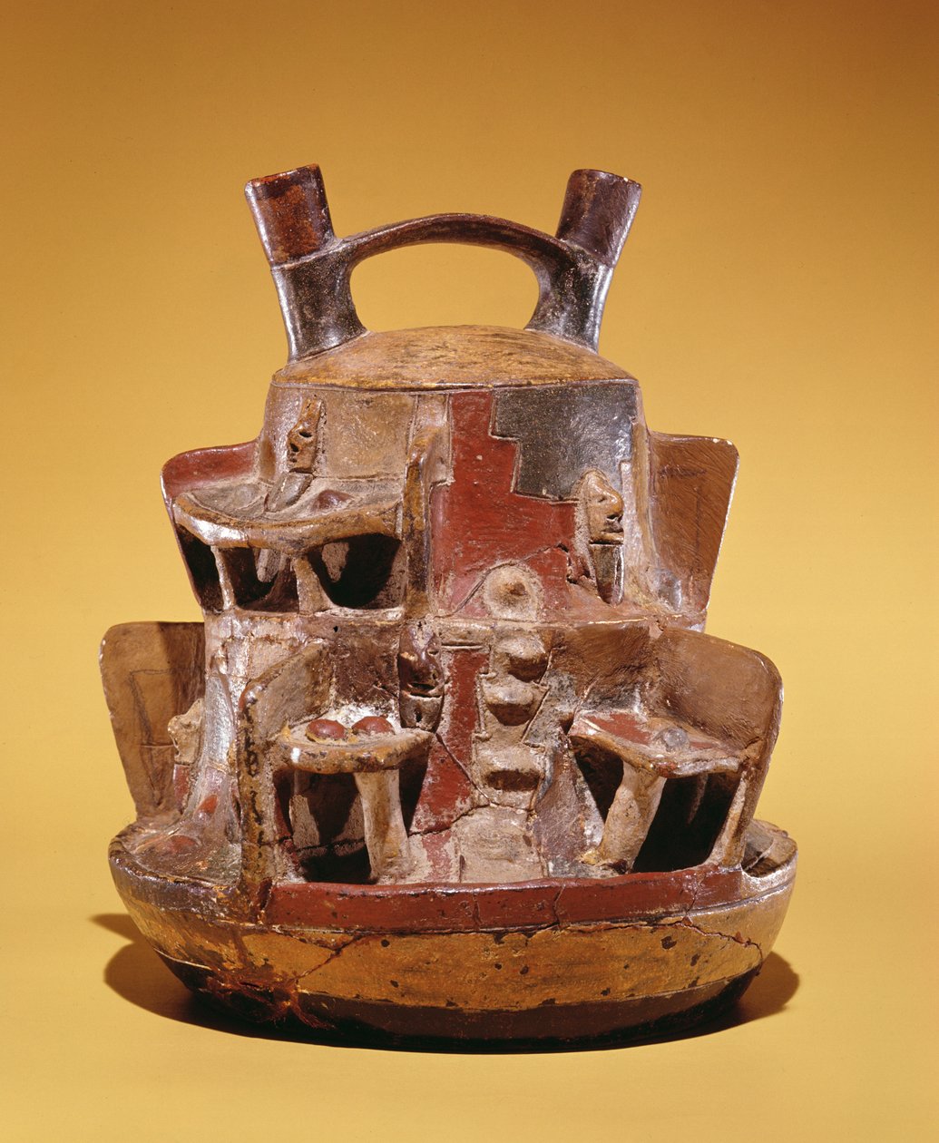 Pottery vessel depicting houses nestled into the Andes