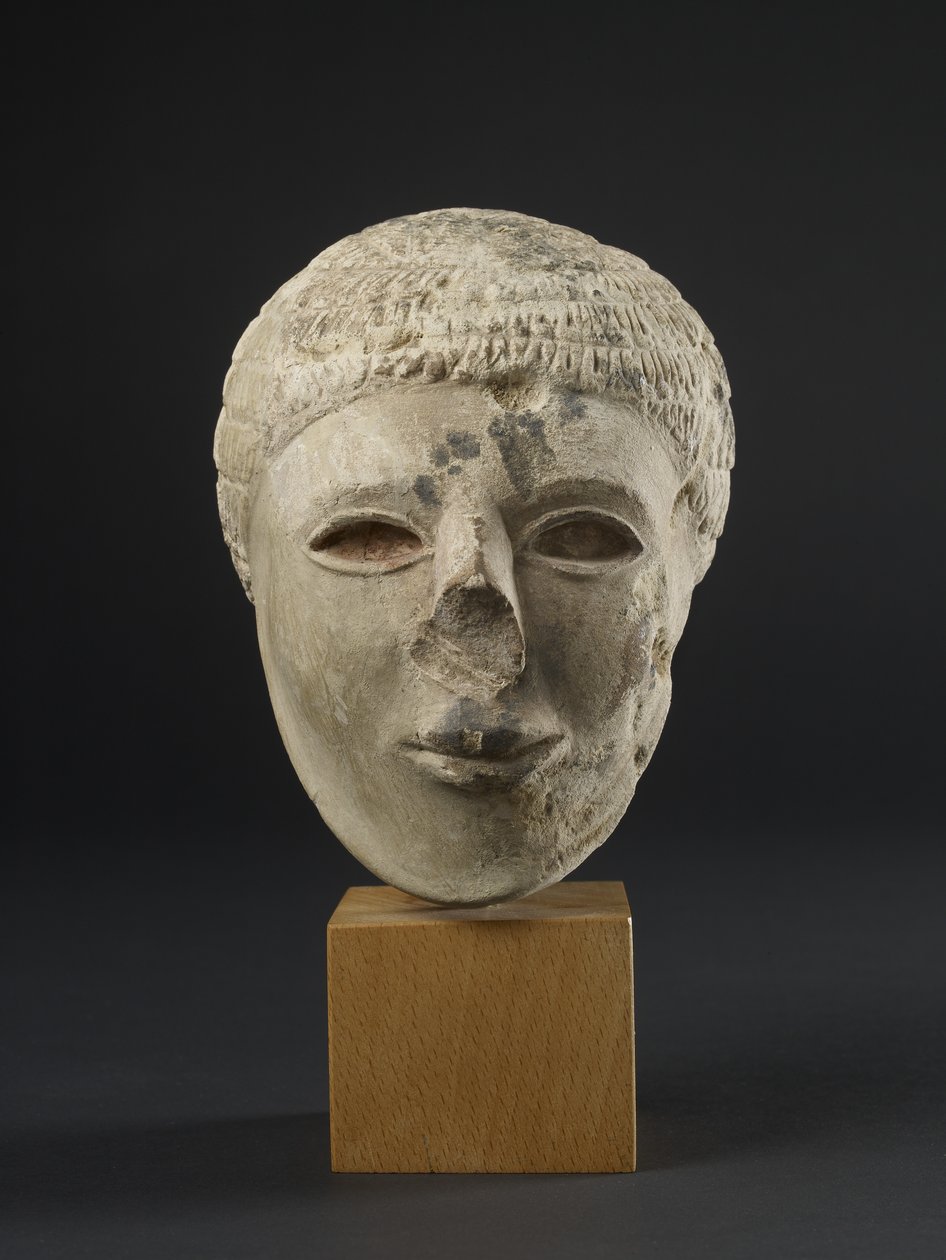 Limestone Statuette of a Bearded Man