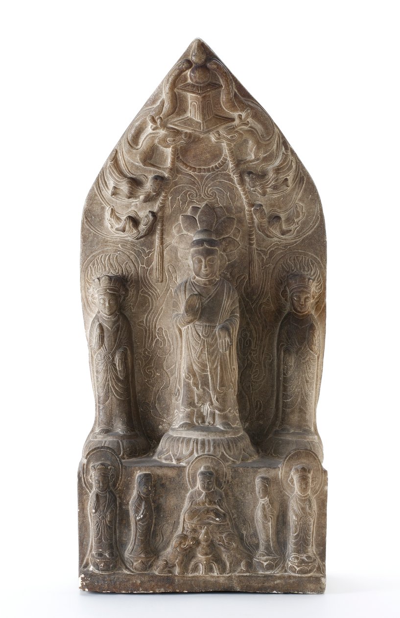 Buddhist trinity in relief on lotus pedestals before pointed background