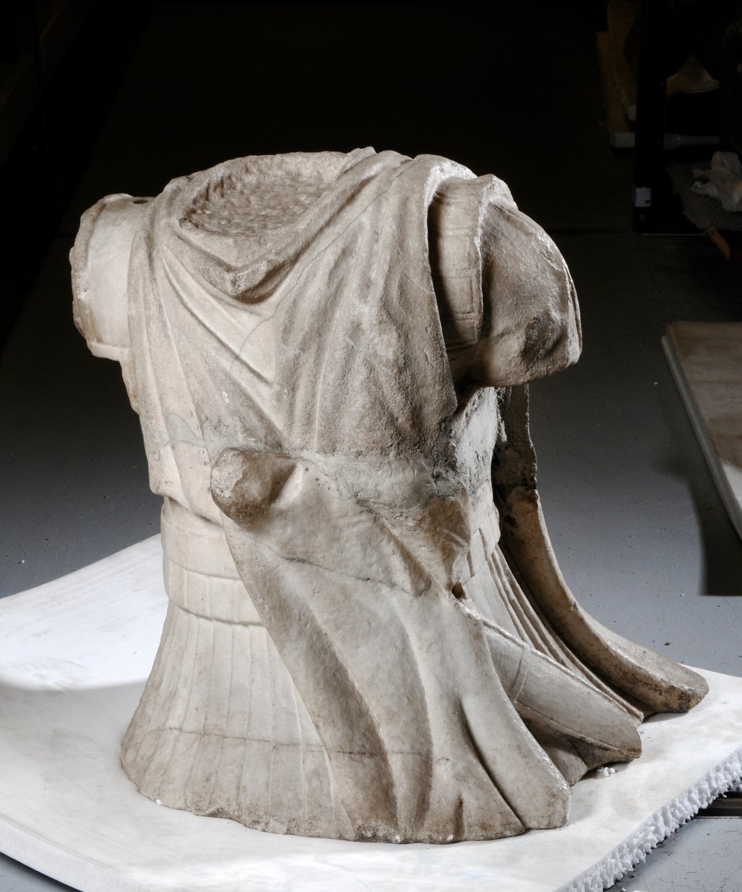 Sculpted torso of a cavalryman with heavy worn cloak