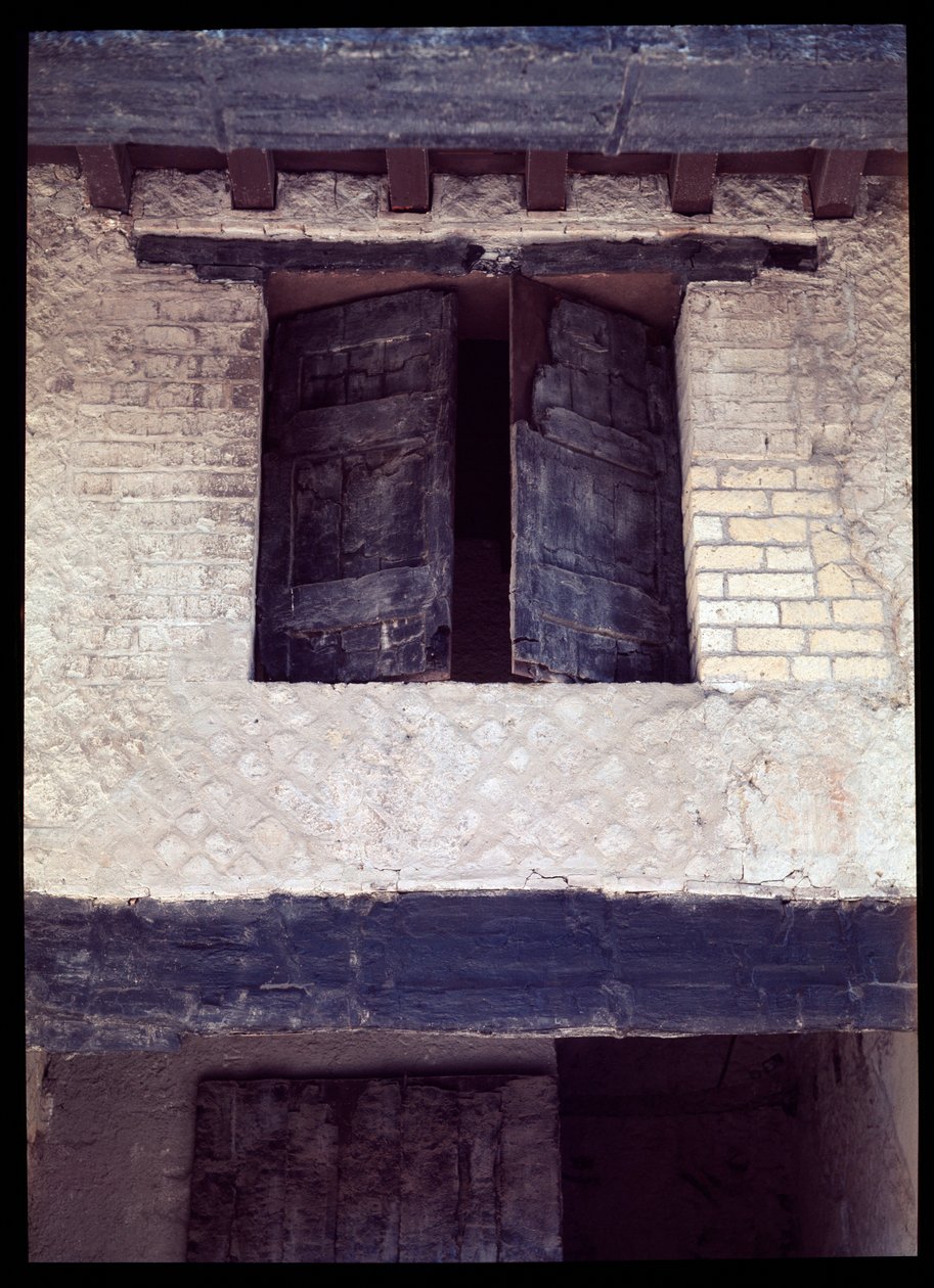 View of a carbonized window of a house of the porch of the decumanus ...
