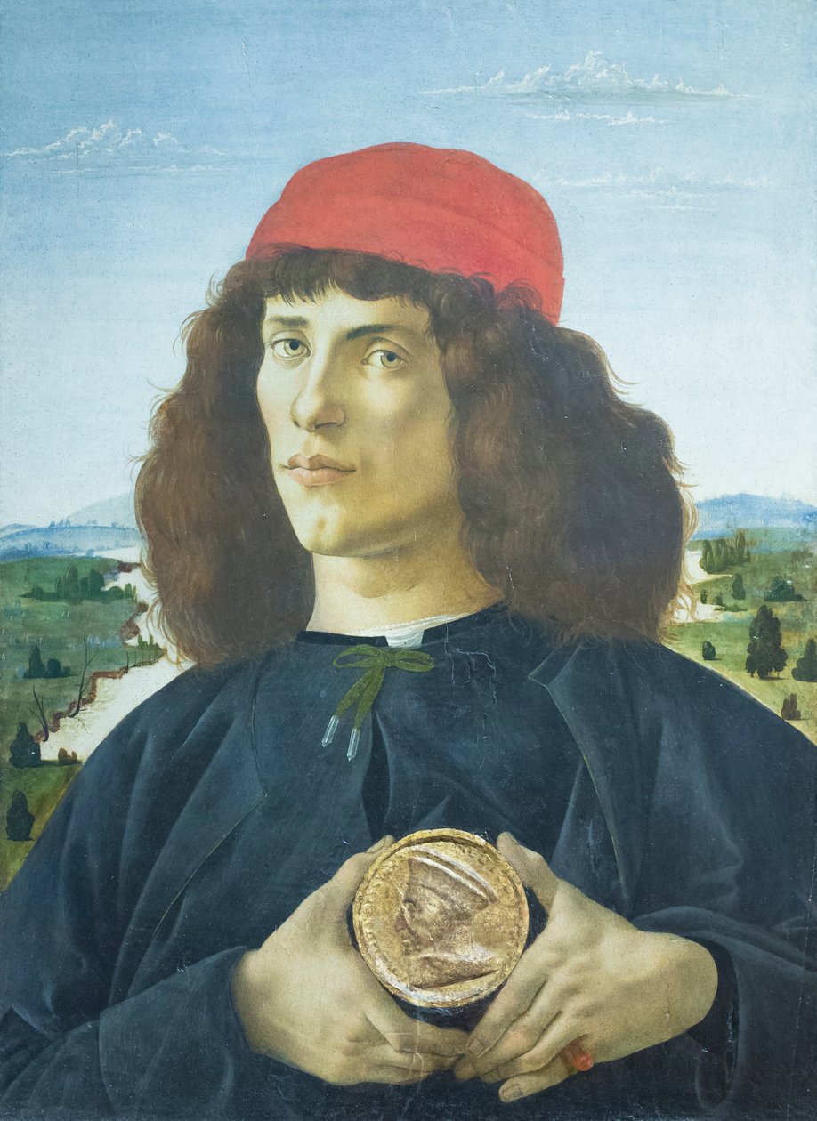 Portrait of a young man holding a medallion of Cosimo de' Medici