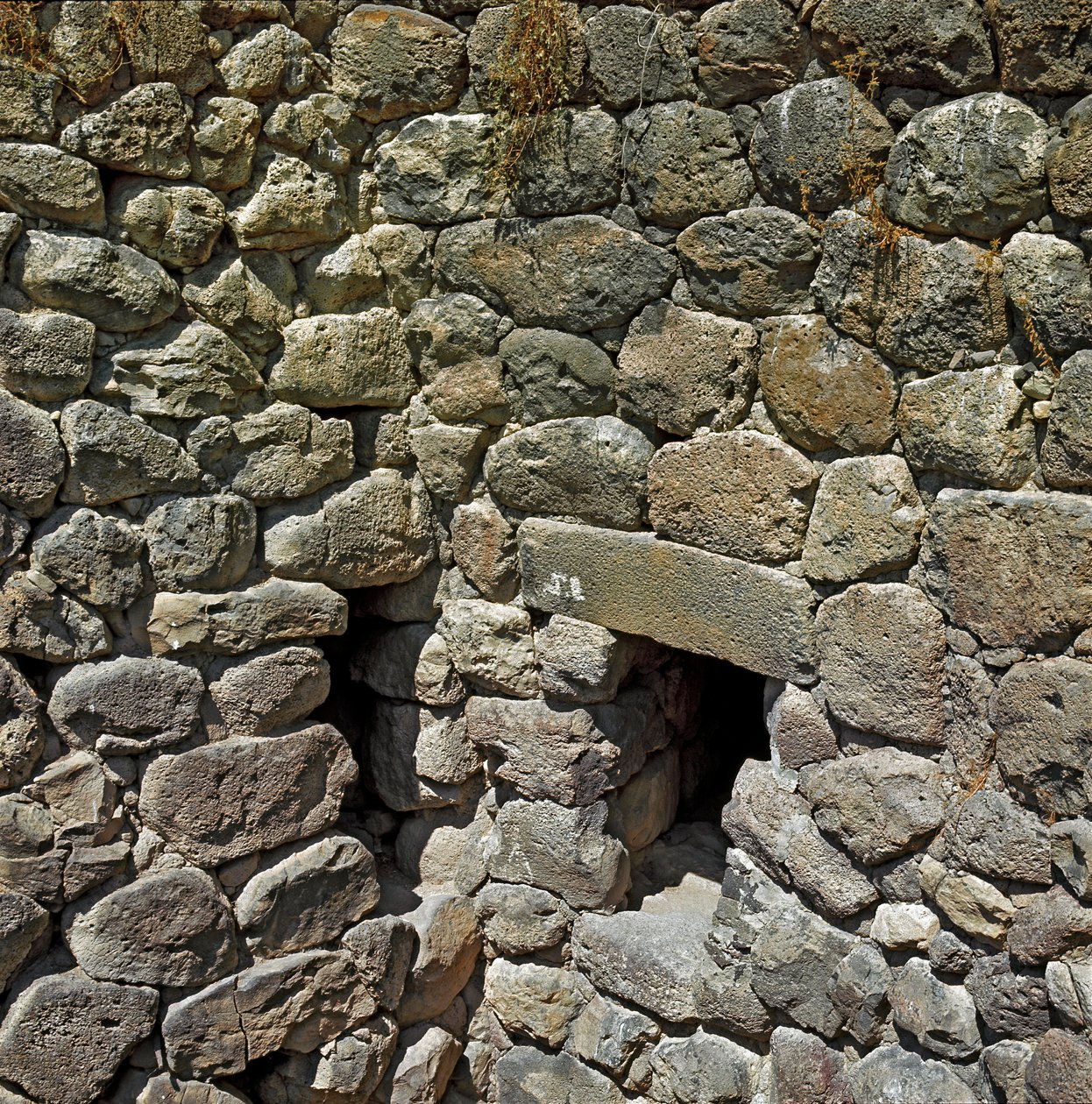 Ruins of the nuragic city of the megalithic site of Su Nuraxi: the ...