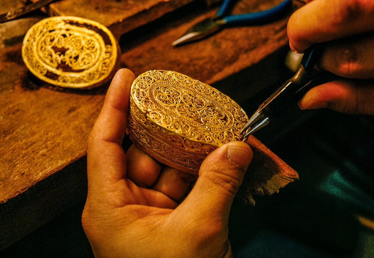 A gold filigree box from a Spanish shipwreck is repaired