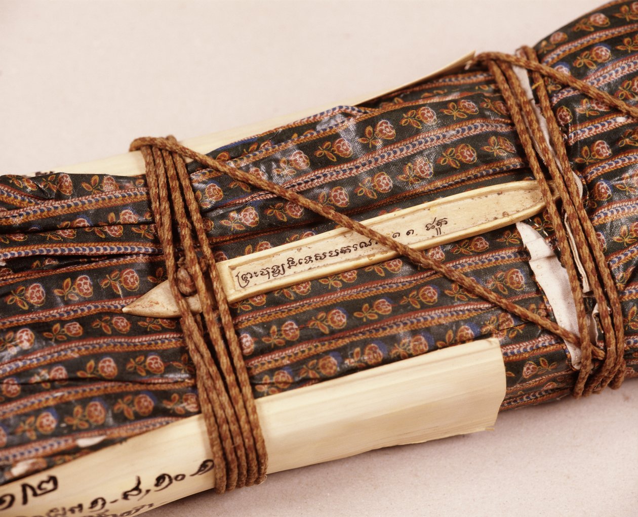 Buddhist Manuscript, Wrapped in Waxed Cloth for Protection