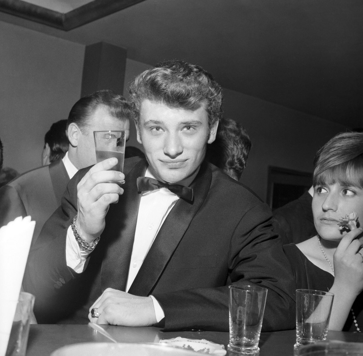 Johnny Hallyday having a cocktail at the bar, Cortina d'Ampezzo, Italy