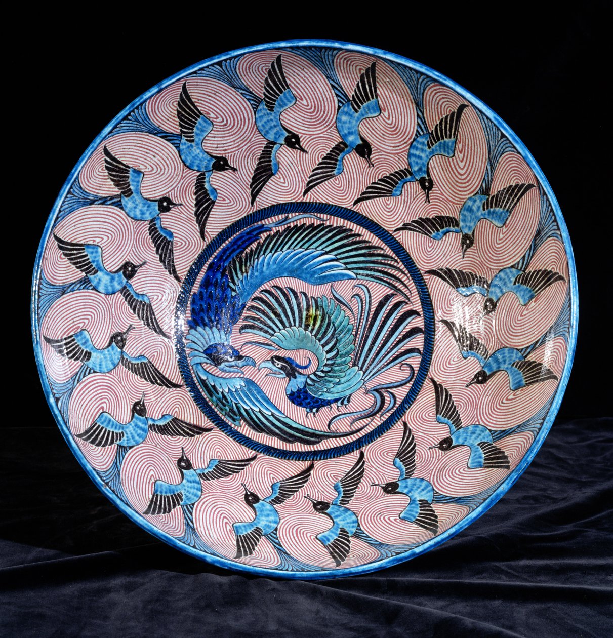 Deep punch bowl, with two eagles in the centre surrounded by swallows