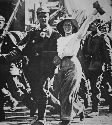 WWI German troops marching off to war, their tunics & rifles festooned ...
