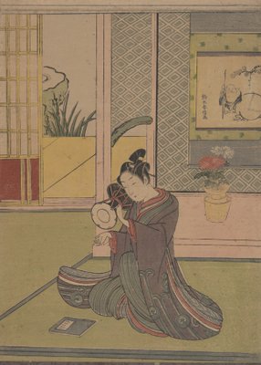 Young Man Playing a Noh Drum. by Suzuki Harunobu