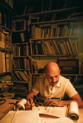 Yigael Yadin, Israeli archeologist, soldier, and politician examines ...