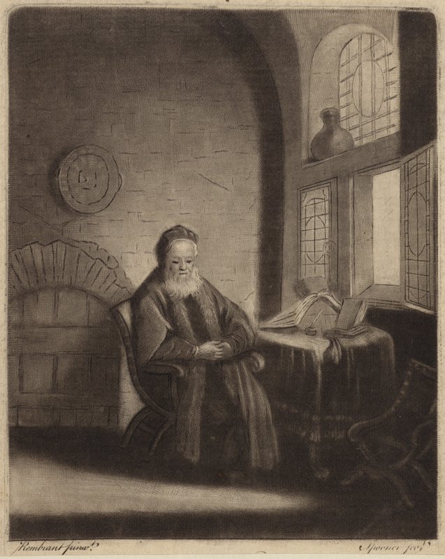 An elderly bearded philosopher sitting at a desk in front of a window